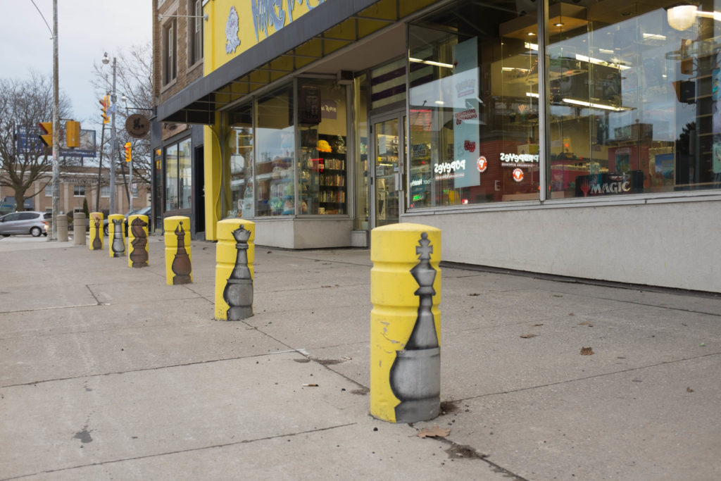 Chess pieces on bollards – a sibilant intake of breath